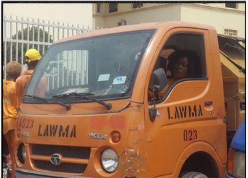Strange! Female Refuse Truck Driver Spotted in Lagos (Photos)