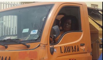 Strange! Female Refuse Truck Driver Spotted in Lagos (Photos)