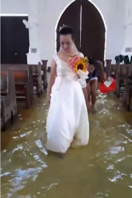 Excitement As Bride And Groom Get Married Inside A Flooded Church (Photos)