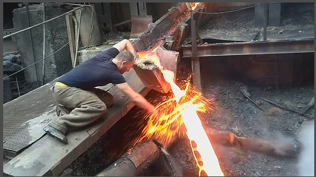 Unbelievable: Man Seen Putting His Hand Into A Burning Molten Metal ...