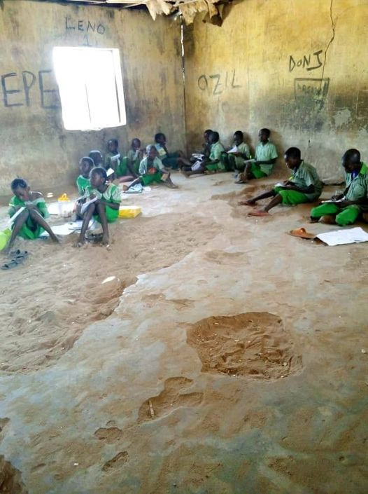Photo of Pupils Sitting on Bare Floor of Dilapidated Classroom in Nasarawa