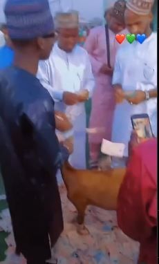 Young Nigerian Men Throw Party For Goat, Spray Lavishly On It (Video)